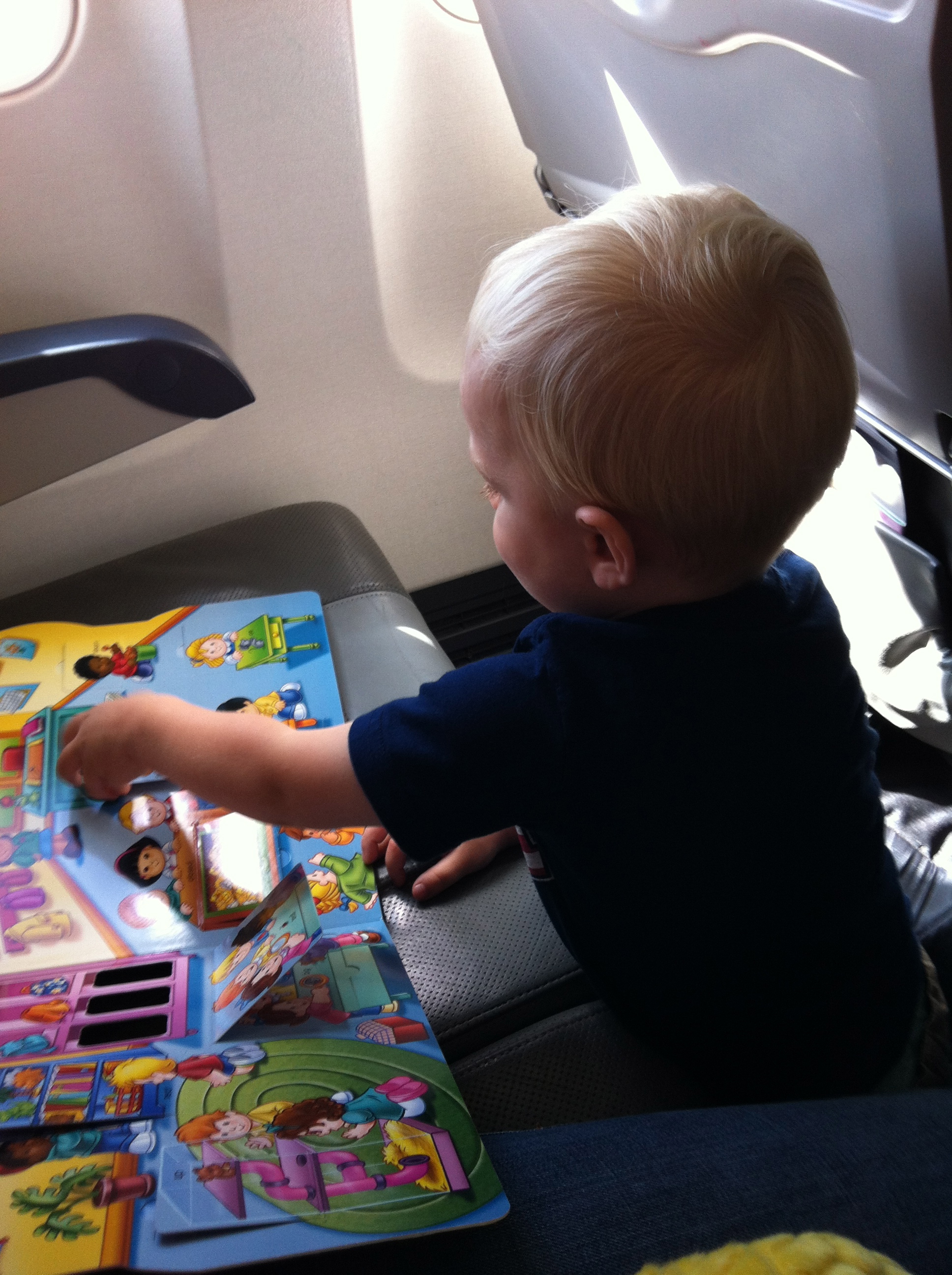 8 Tips for Airplane Travel with Kids | North of Something